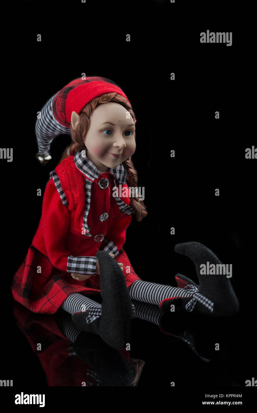 Christmas doll elf in striped pants with a cap Stock Photo - Alamy