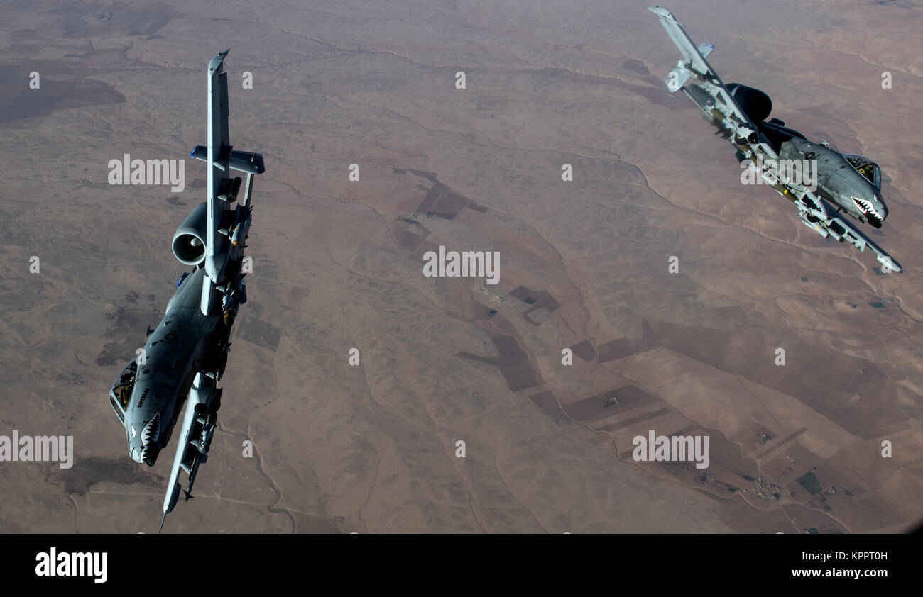 Two U.S. Air Force A-10 Thunderbolt II depart to continue a mission ...