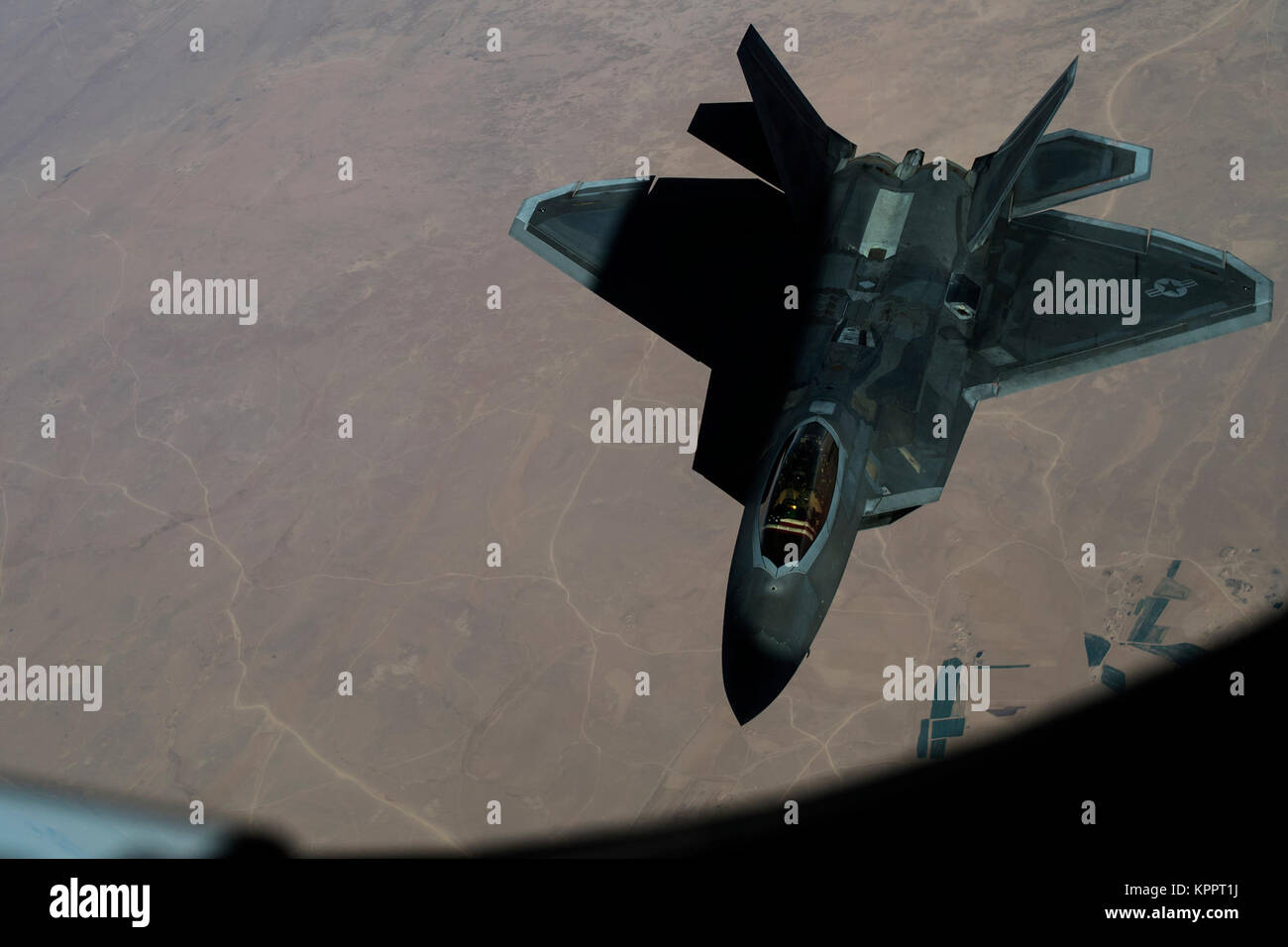 A U.S. Air Force F-22 Raptor receives fuel from a KC-135 Stratotanker ...