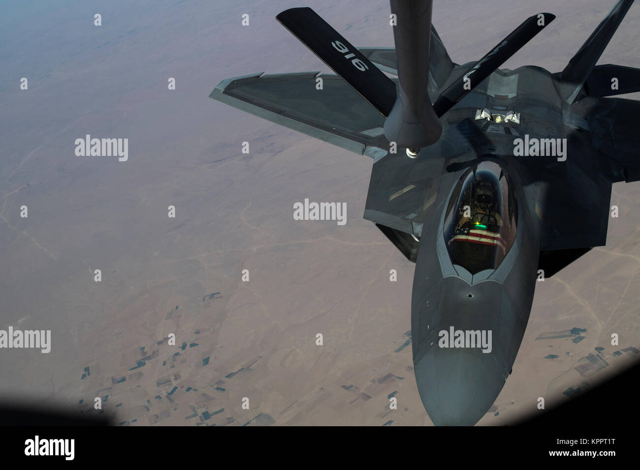 A U.S. Air Force F-22 Raptor receives fuel from a KC-135 Stratotanker ...