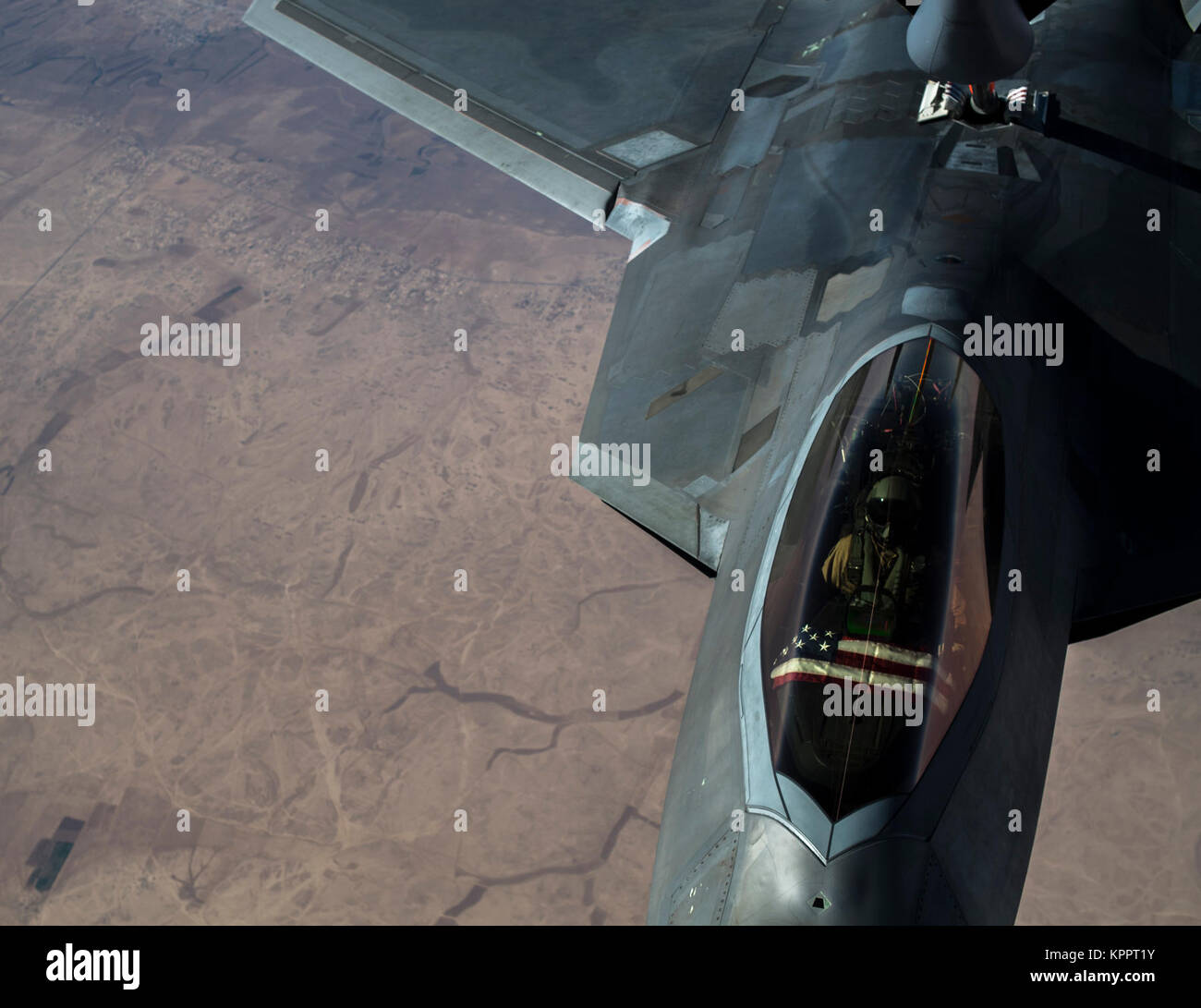 A U.S. Air Force F-22 Raptor receives fuel from a KC-135 Stratotanker ...