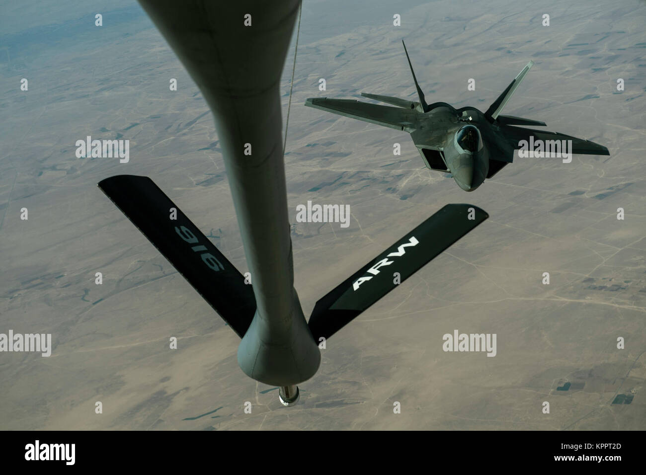 A U.S. Air Force F-22 Raptor receives fuel from a KC-135 Stratotanker ...