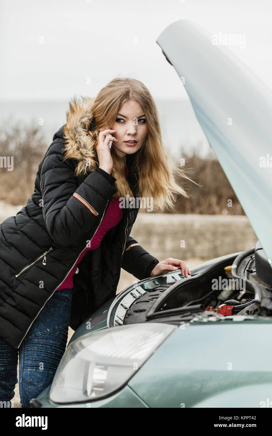 Accident and breakdowns with auto concept. Broken down car, blonde ...