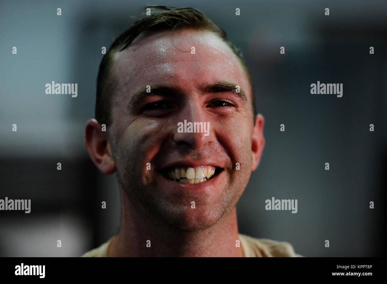 1st Lt. Michael Thrasher, 380th Expeditionary Security Forces, smiles ...