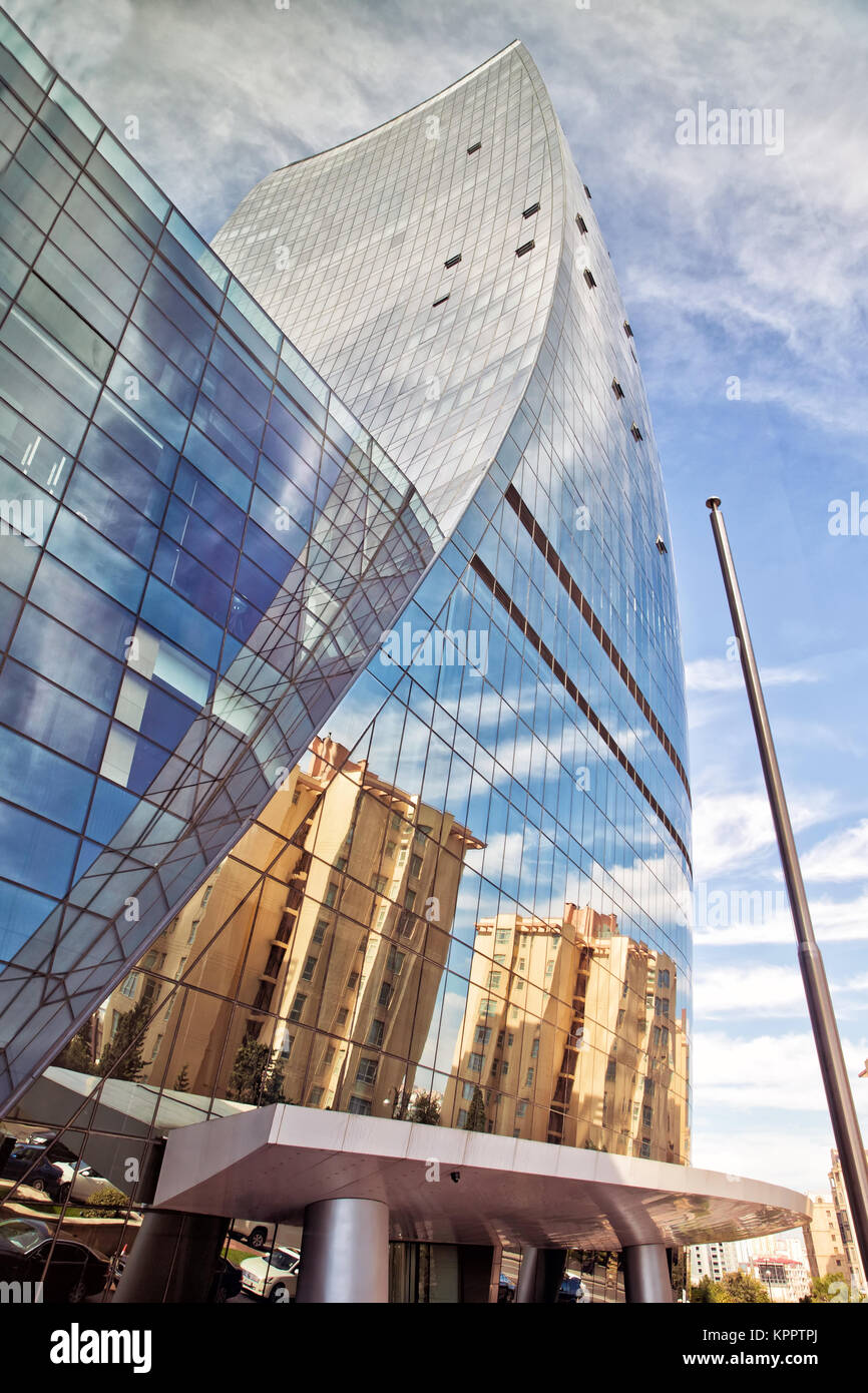 building glass, modern architecture Clouds Reflected in Windows of ...