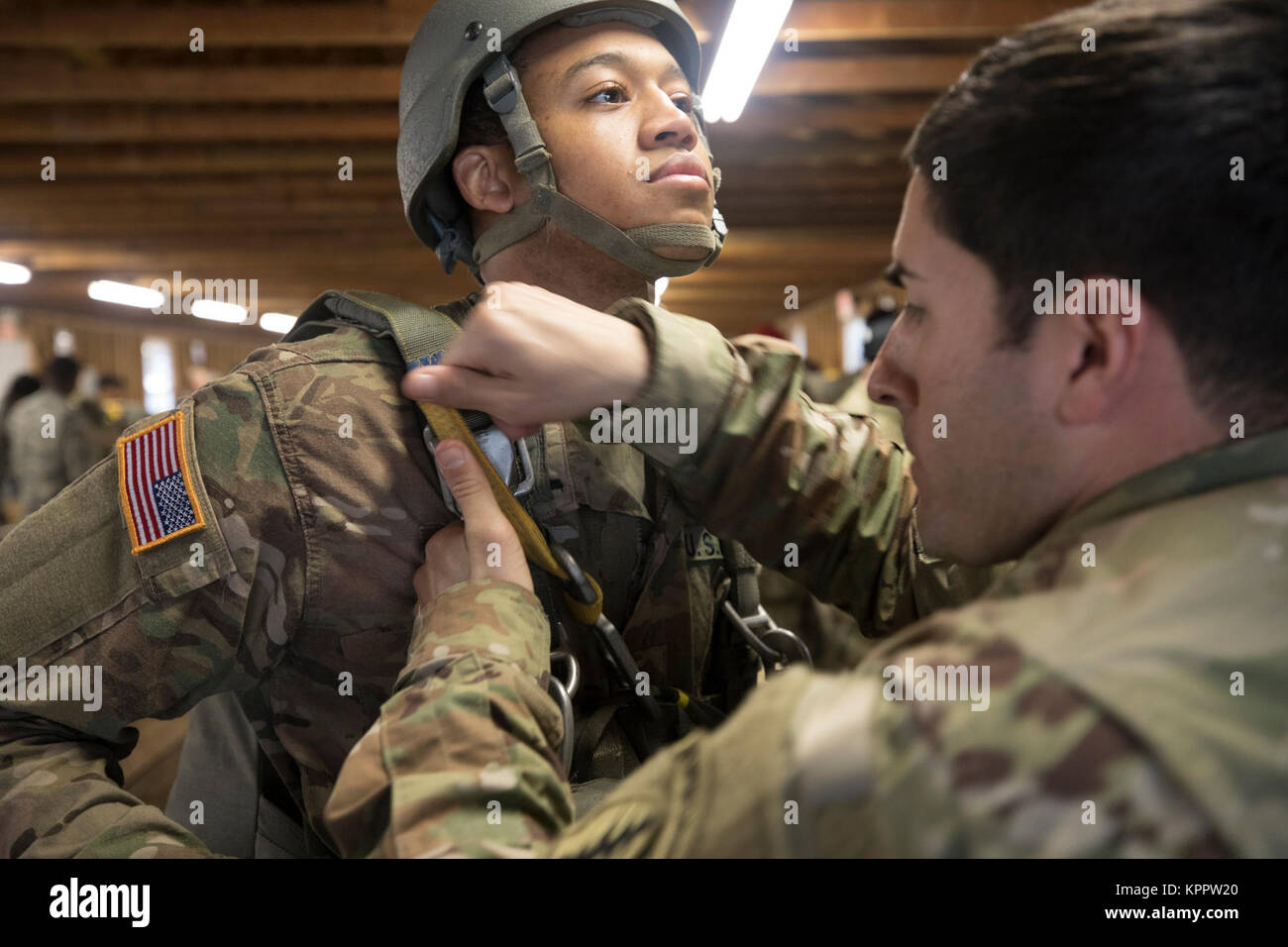 A U.S. Army paratrooper receives Jumpmaster Personal Inspection (JMPI ...