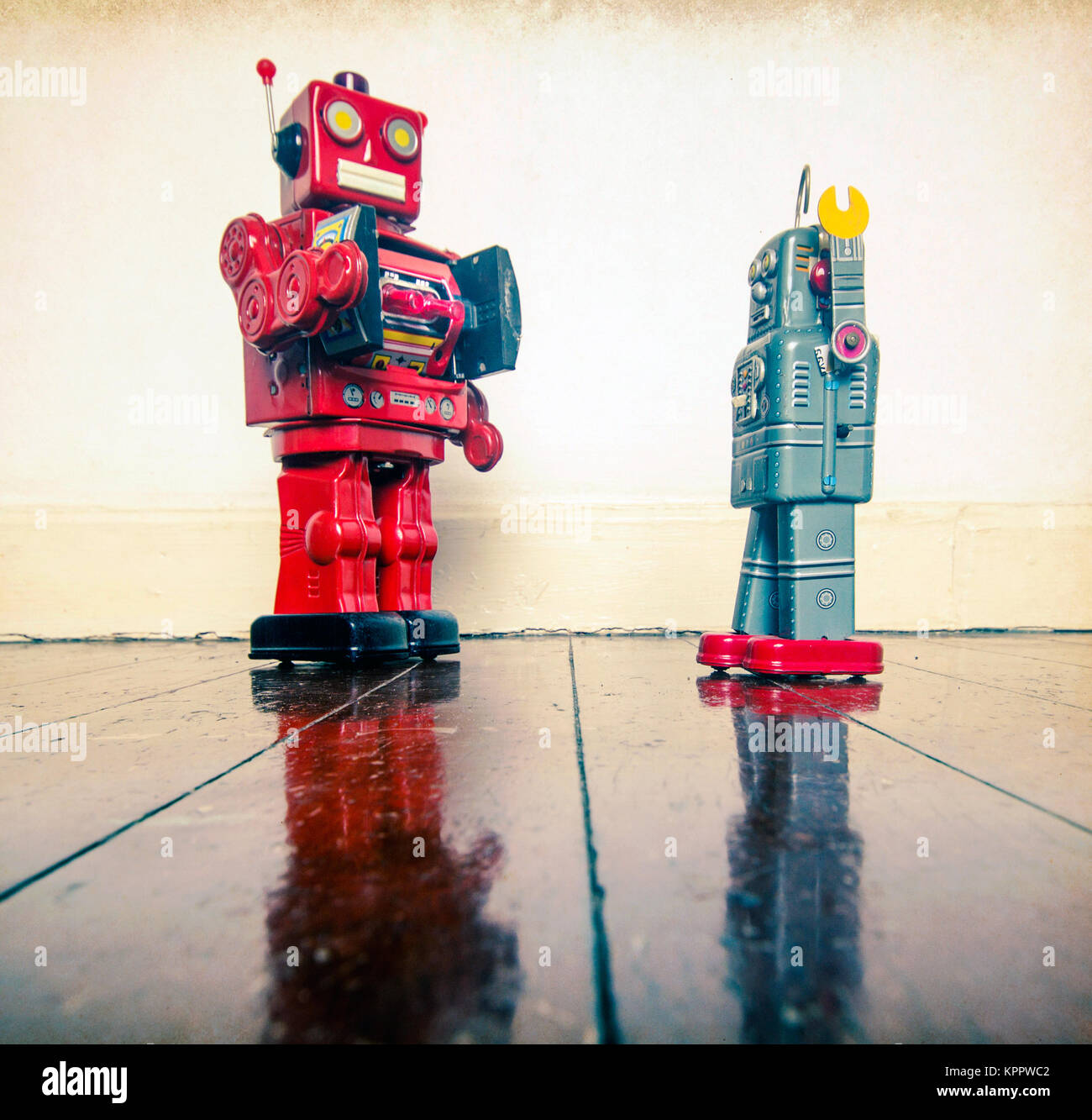 stick them up , robo cop puts robot undr arrest , on old wooden floor ...