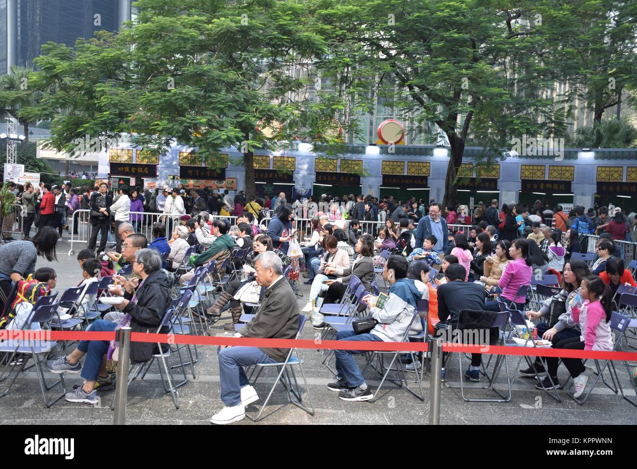 Crowd of asian people sit in front of a stage in Chaozhou market in ...