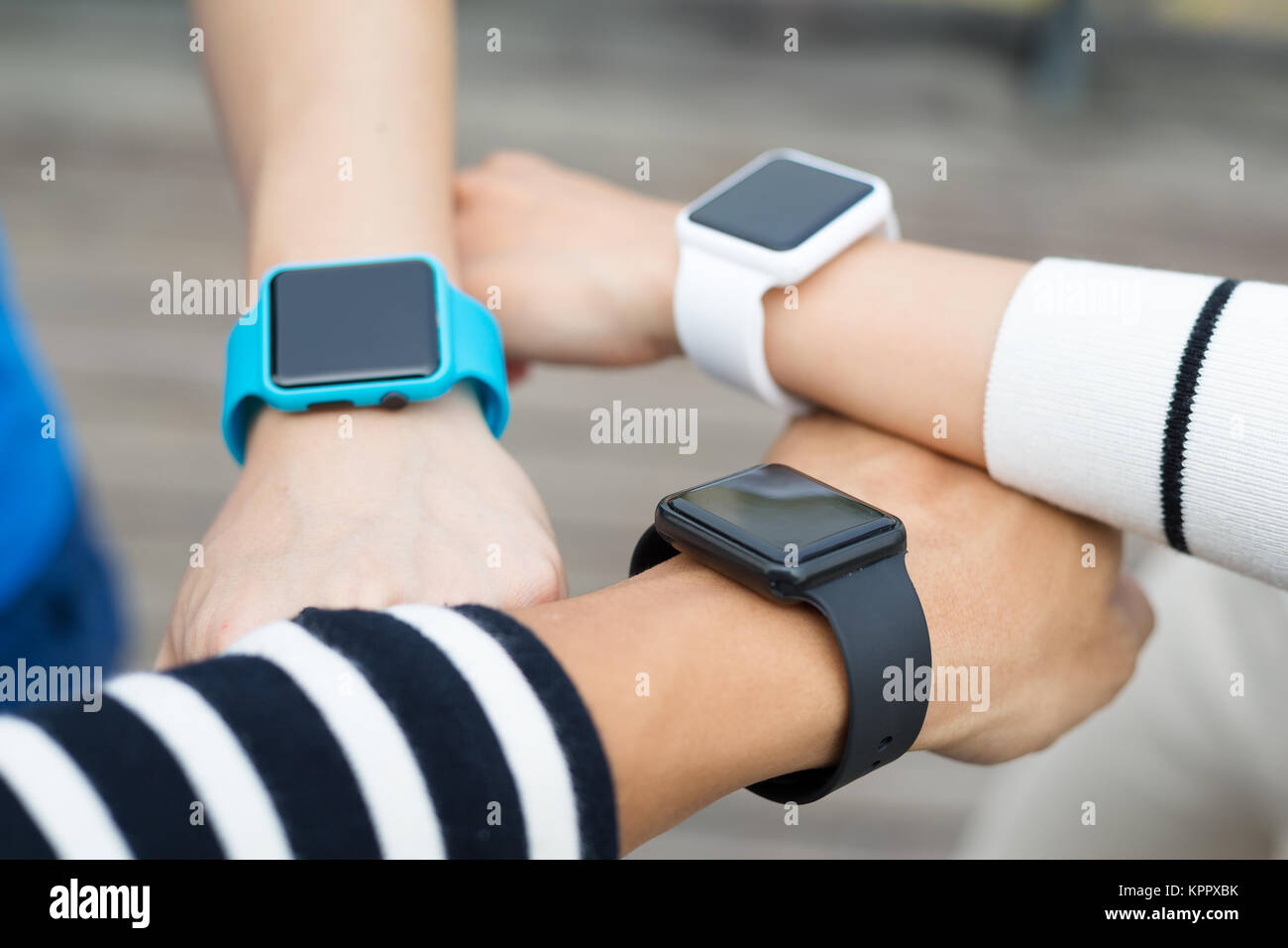 Group of people using wmart watch Stock Photo - Alamy