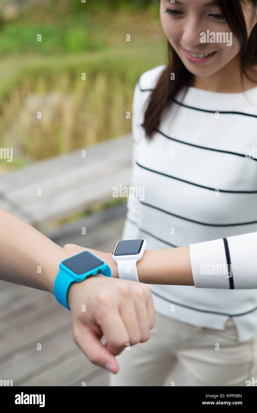 Two people connecting smartwatch together Stock Photo - Alamy