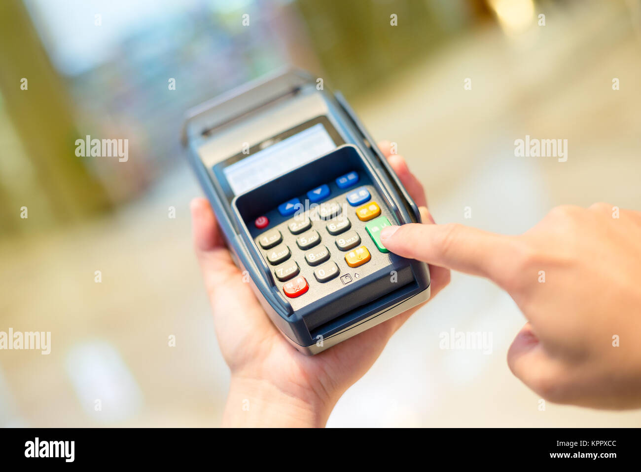 Customer finger press the button on the pos machine Stock Photo - Alamy