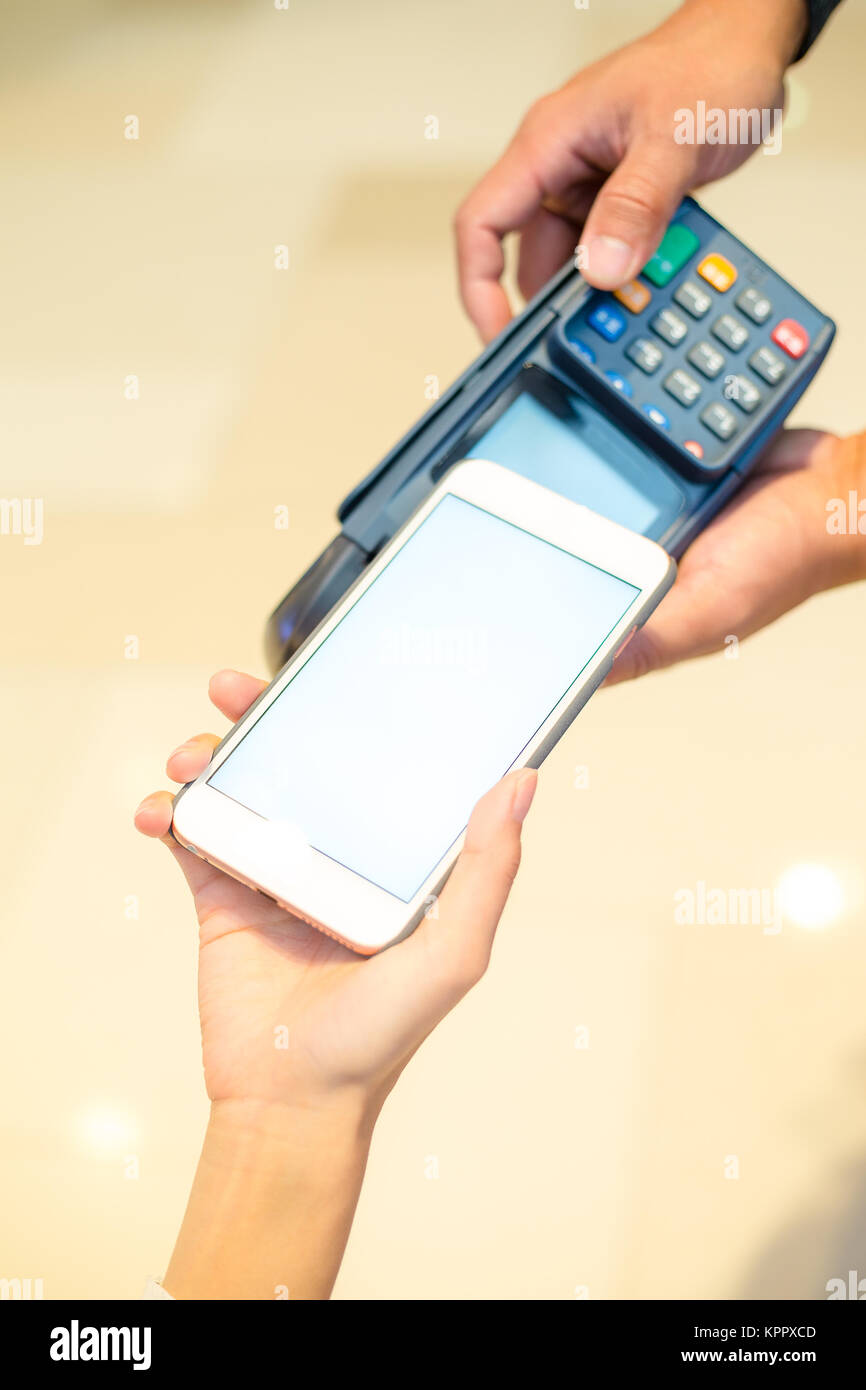 Customer pay with mobile phone Stock Photo - Alamy