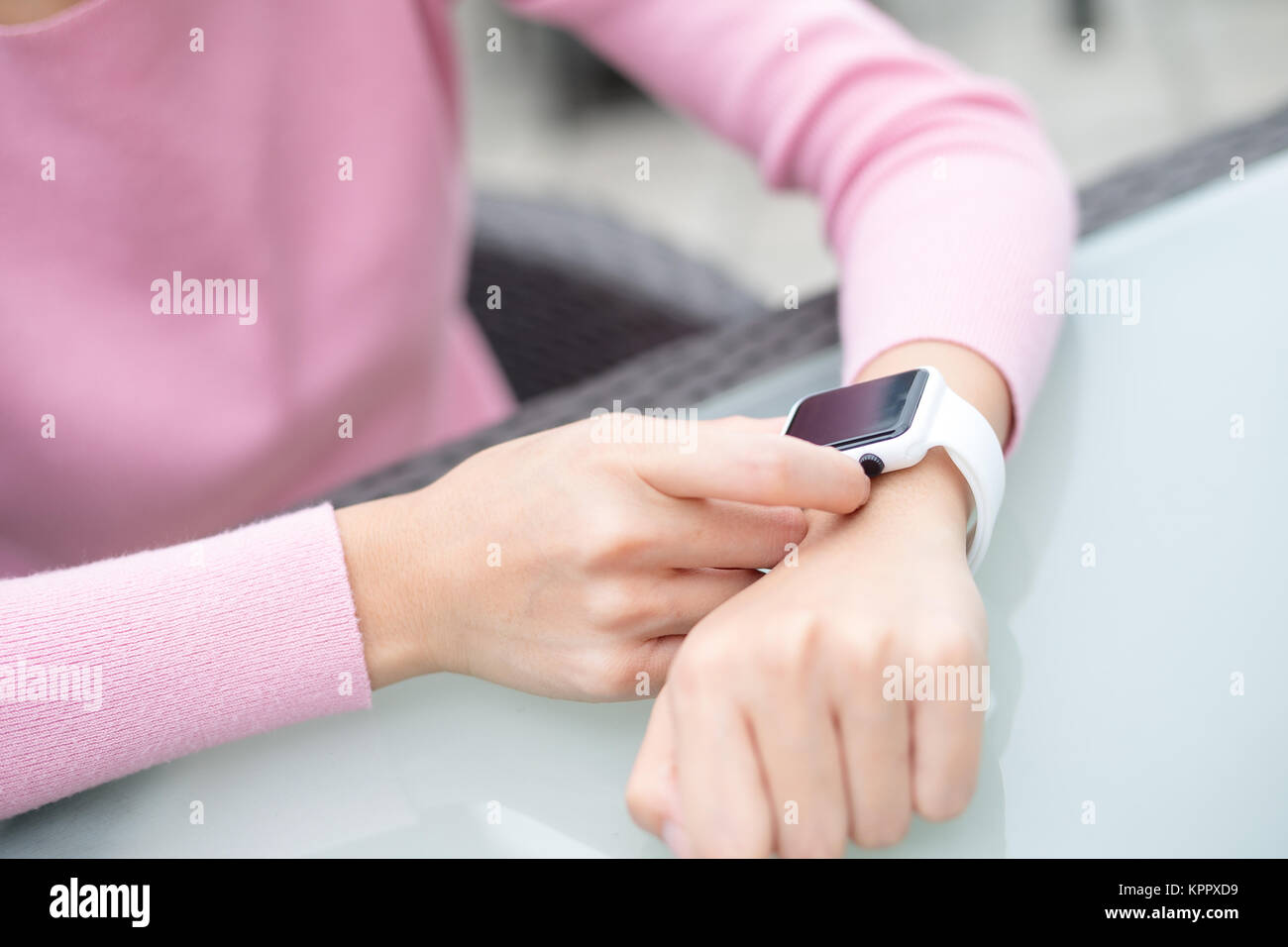 Woman using smart watch Stock Photo - Alamy