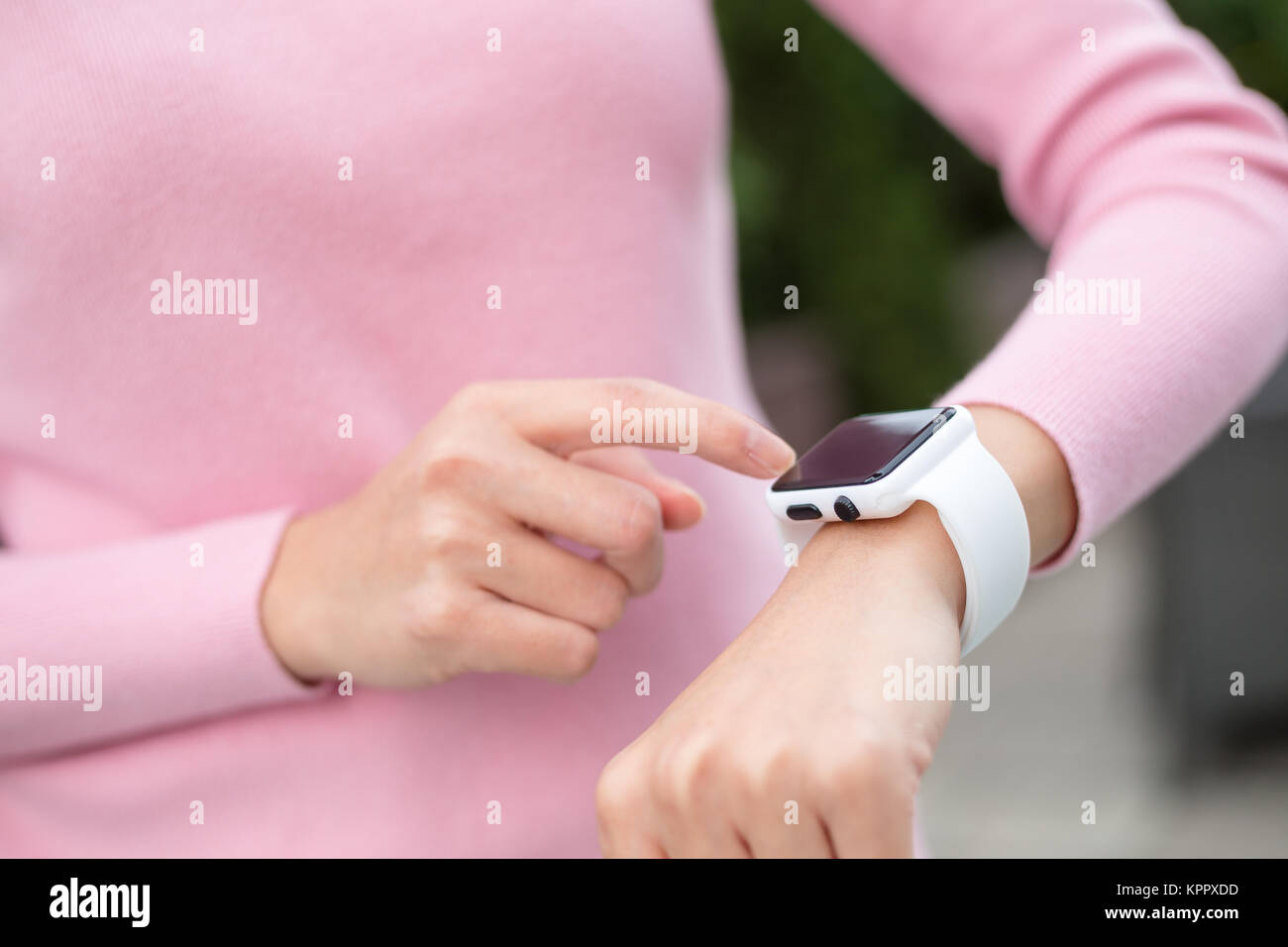 Woman touch on the screen of smart watch Stock Photo - Alamy