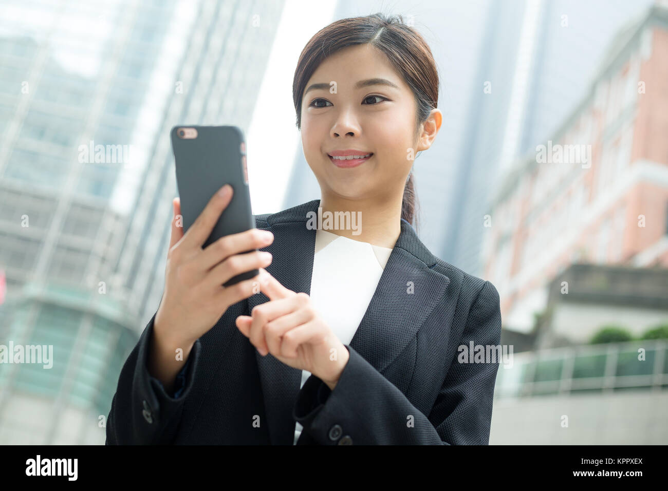 Business woman read the message on cellphone Stock Photo - Alamy
