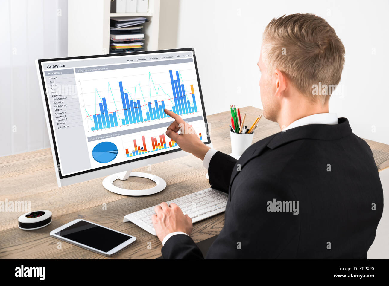 Businessman Analyzing Graphs On Computer Stock Photo - Alamy