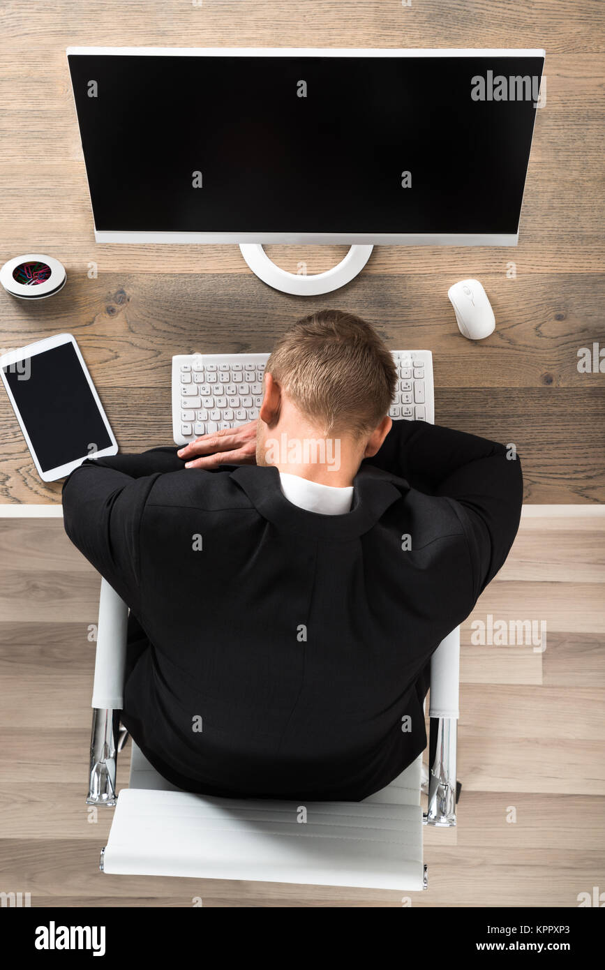 Businessman Sleeping In Office Stock Photo - Alamy