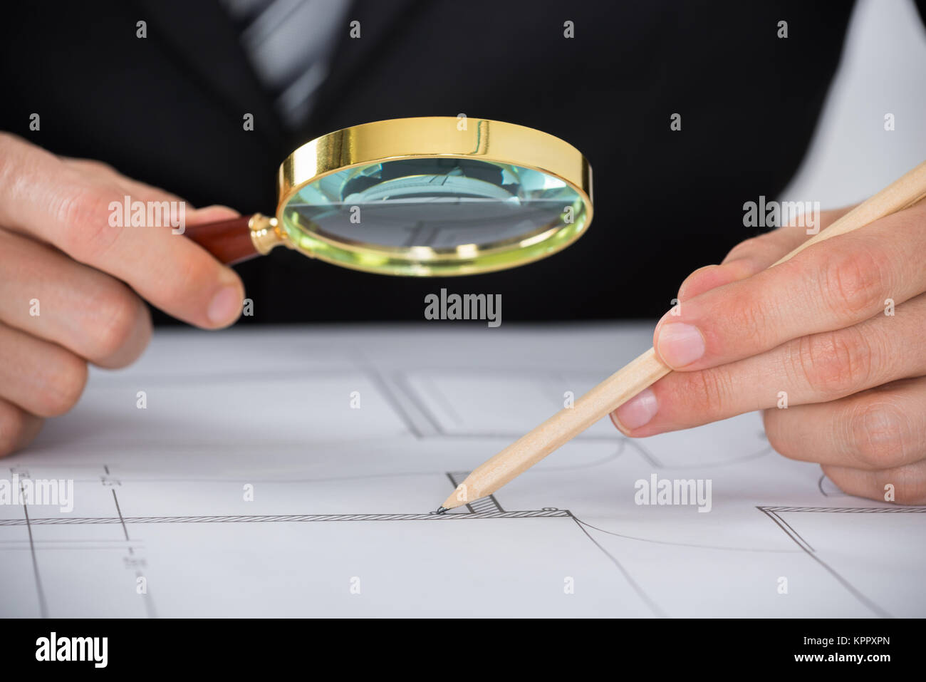 Architect Hand Using Magnifying Glass On Blueprint Stock Photo - Alamy
