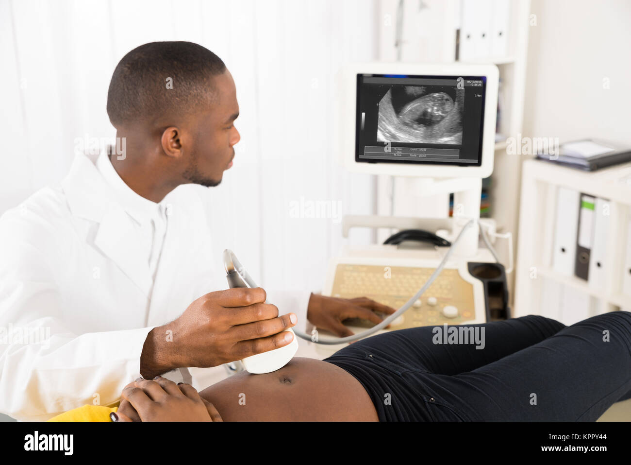 Gynecologist Checking Pregnant Woman's With Ultrasound Stock Photo - Alamy