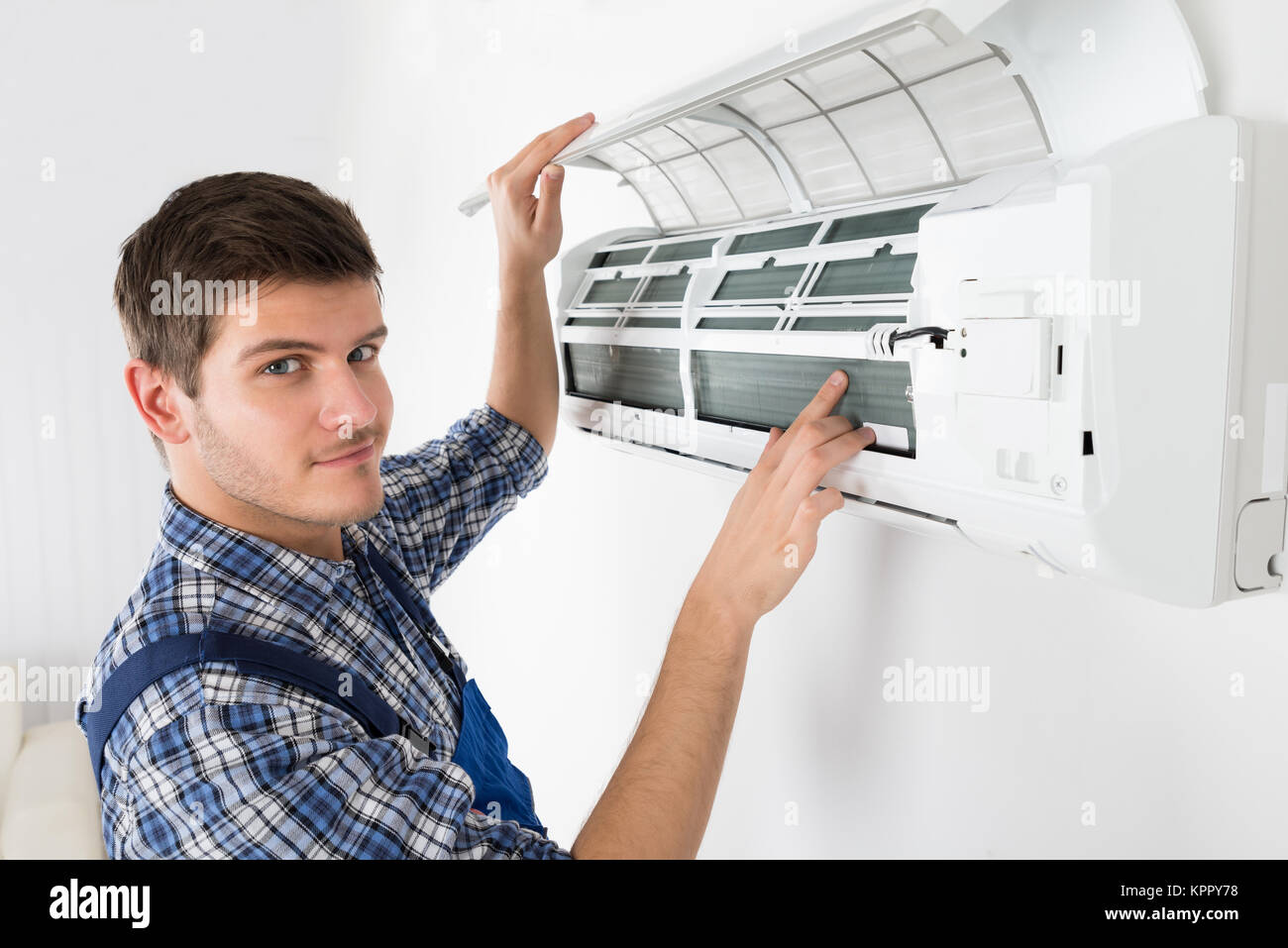 Male Technician Repairing Air Conditioner Stock Photo - Alamy