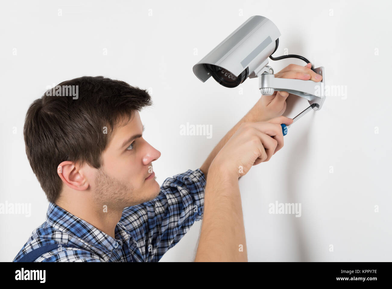 Technician Adjusting CCTV Camera Stock Photo - Alamy