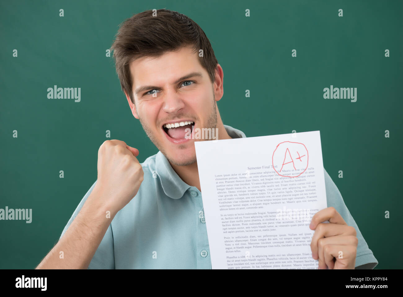Happy Man Holding Examination Paper Stock Photo - Alamy
