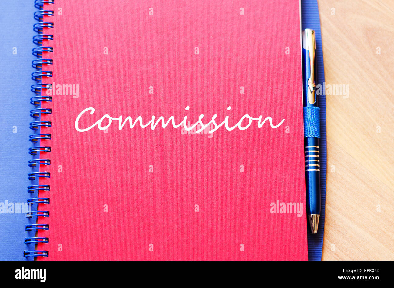 Commission write on notebook Stock Photo - Alamy