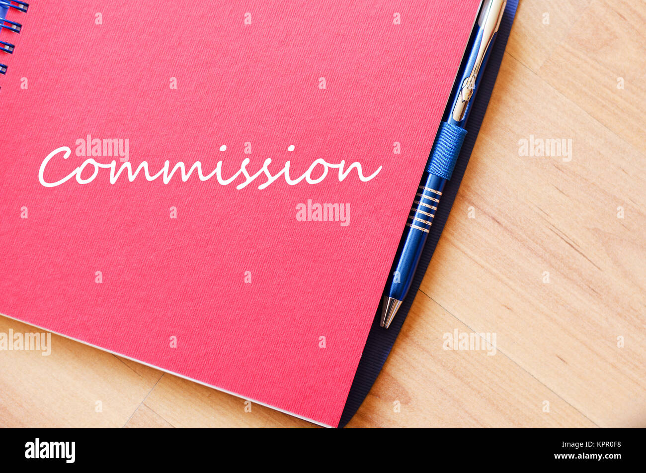 Commission write on notebook Stock Photo - Alamy