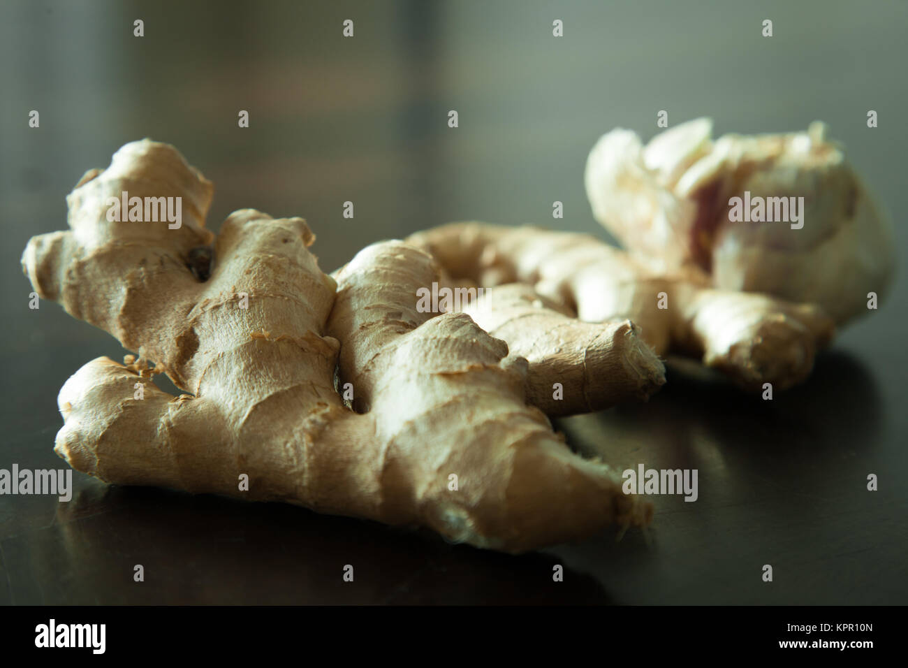 Ginger and garlic on a shiny wooden table Stock Photo - Alamy