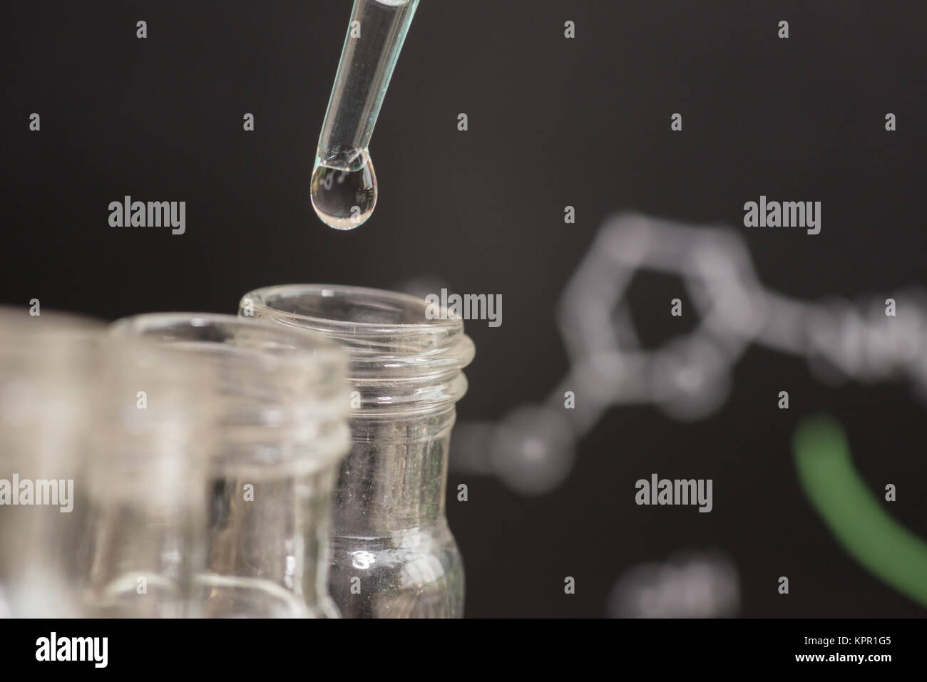 Liquid drop on test tube Stock Photo - Alamy