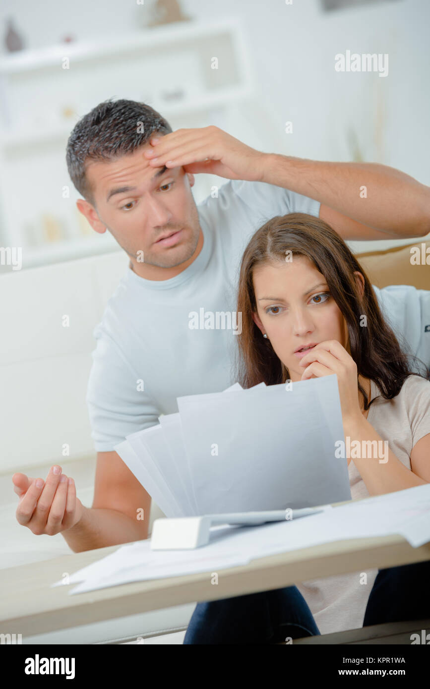 Couple arguing over bills Stock Photo - Alamy