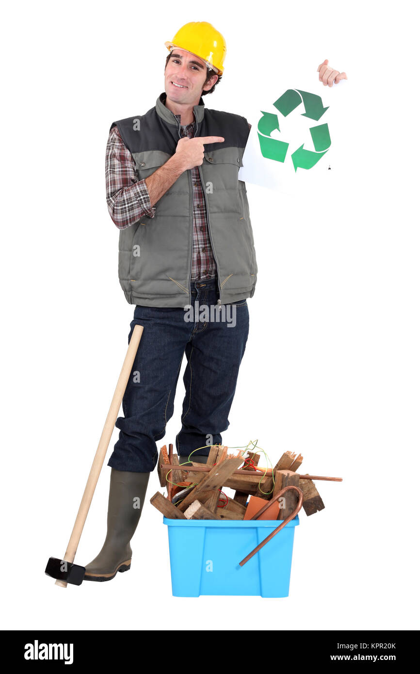 Builder recycling waste Stock Photo - Alamy