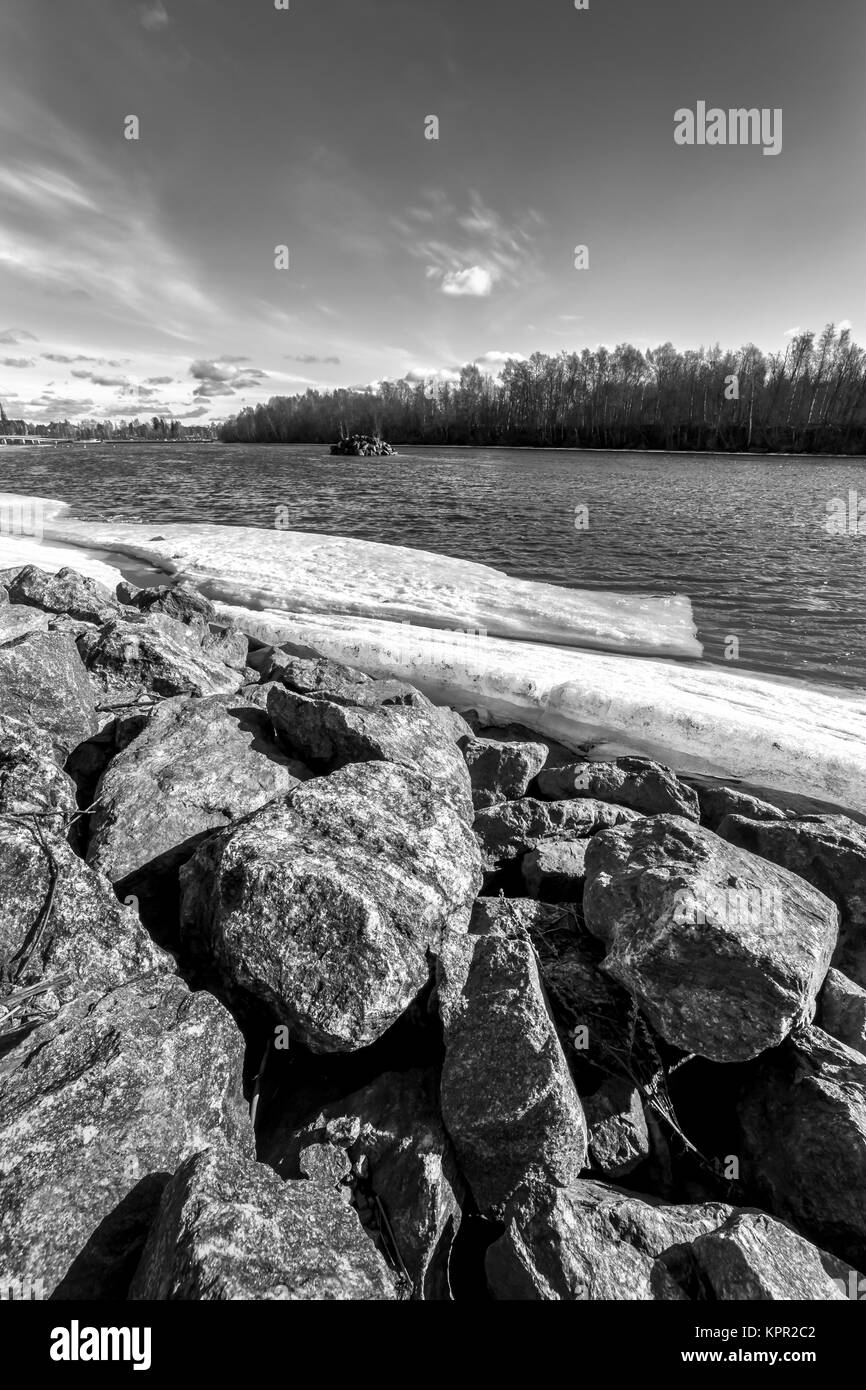 Ice and Rocks by River Stock Photo - Alamy