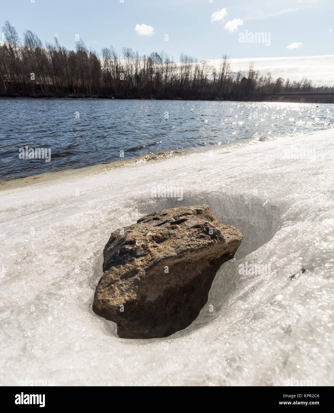 Stone in Ice by River Stock Photo - Alamy