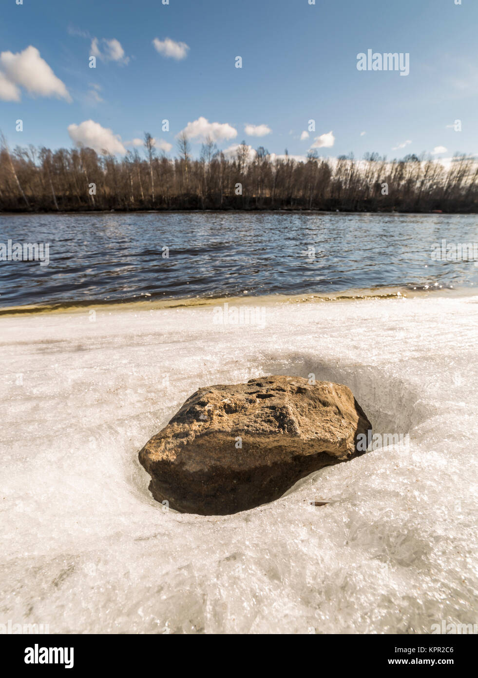 Stone in Ice by River Stock Photo - Alamy