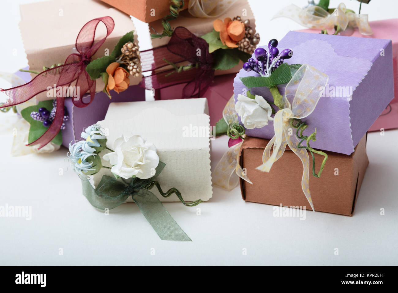 Fancy carton wedding gift boxes with ribbon and flowers Stock Photo - Alamy