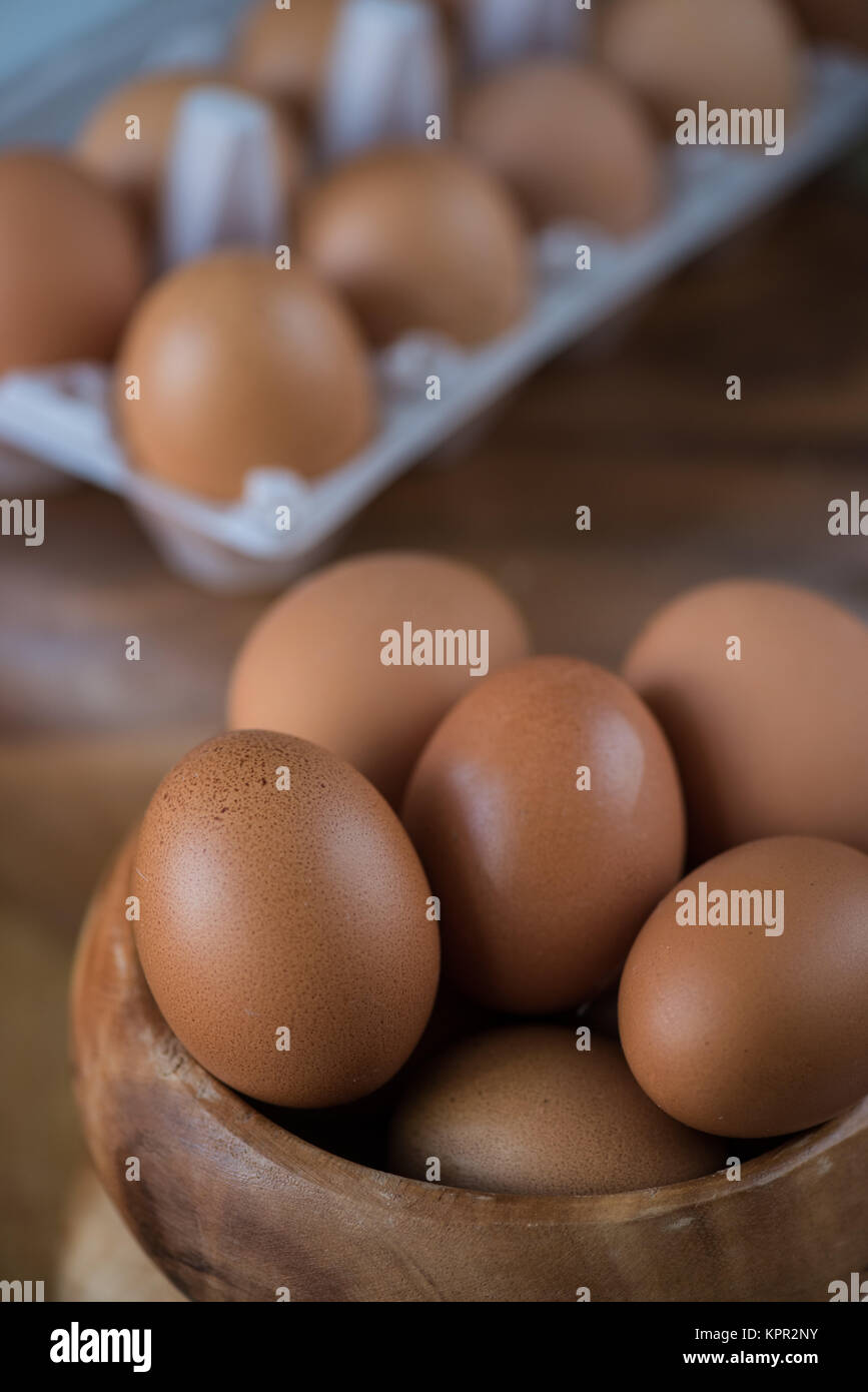 Fresh eggs at wooden plate Stock Photo - Alamy