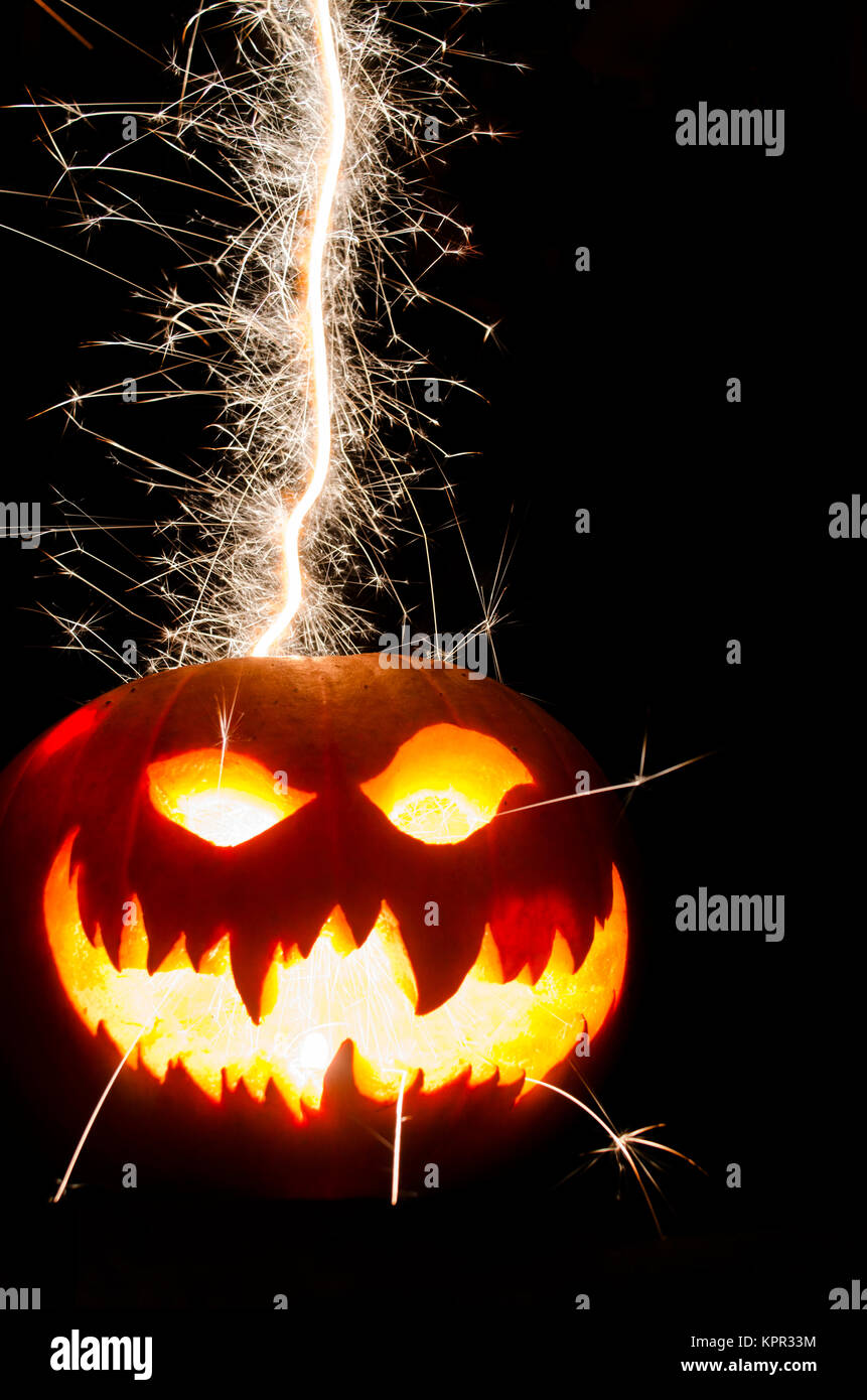 Halloween Pumpkin Carving Face with Sparkler Stock Photo - Alamy