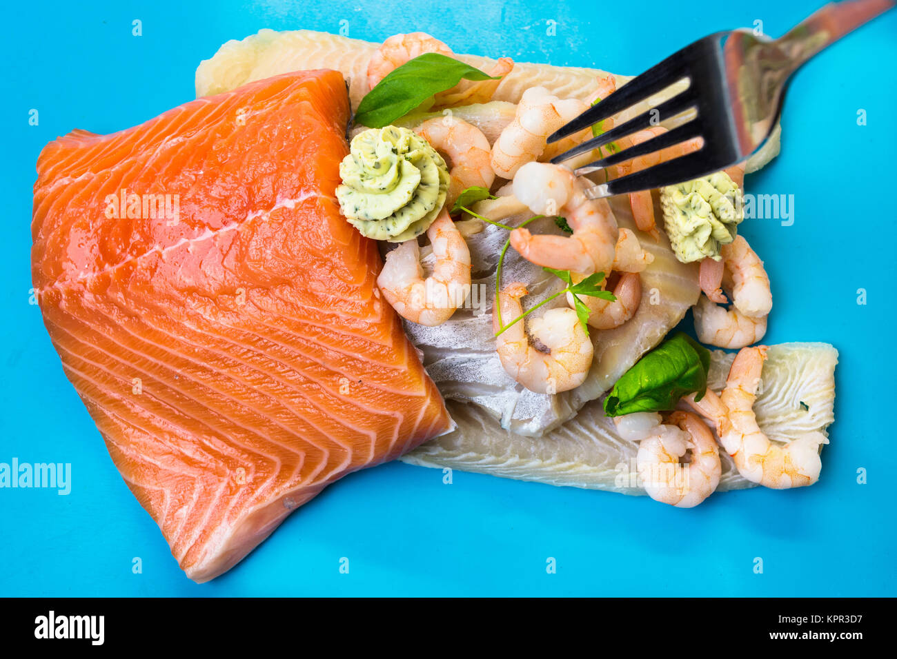 Various raw fish species as fillets like salmon, cod and shrimp Stock ...