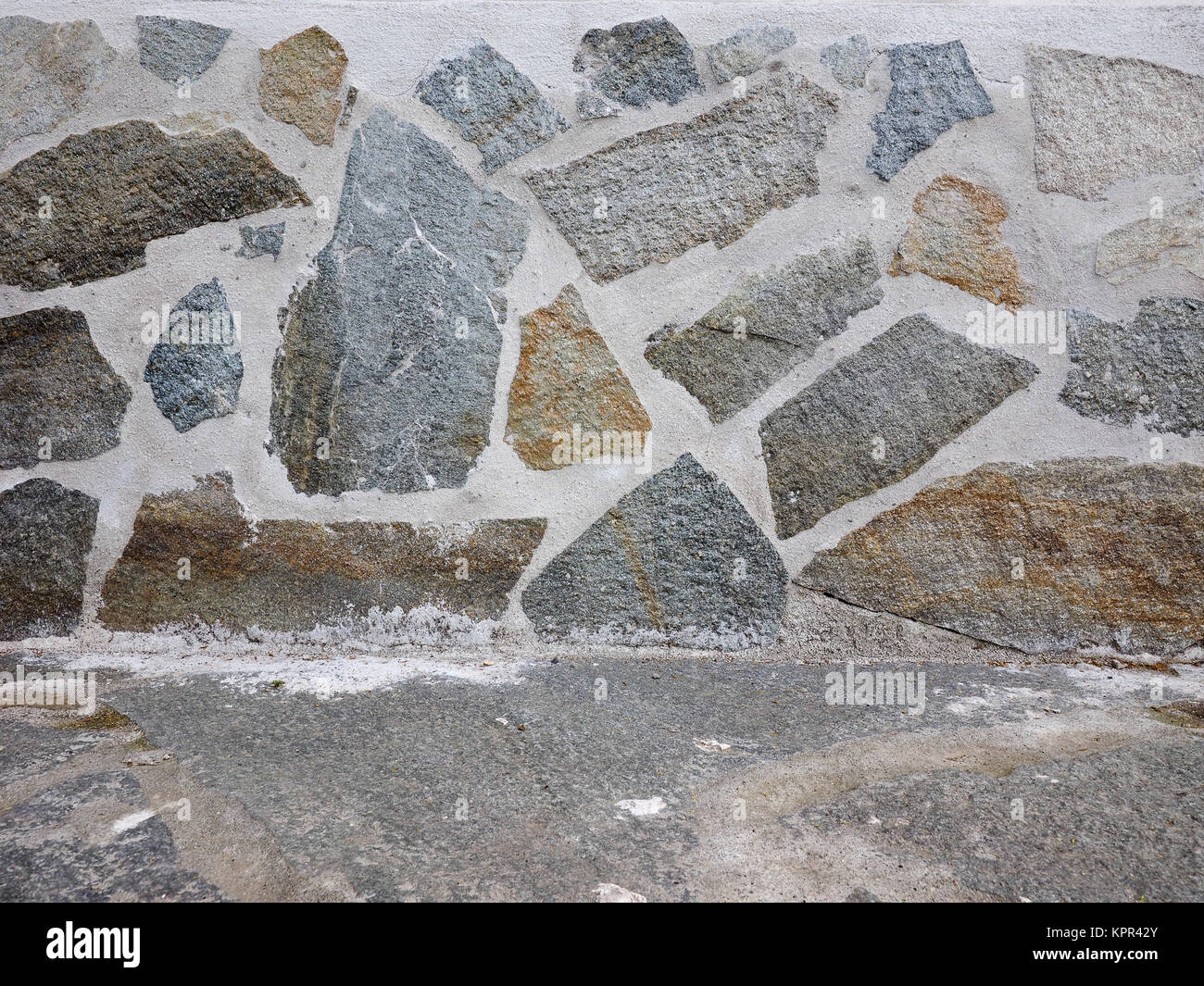 Wall with stones finish Stock Photo - Alamy