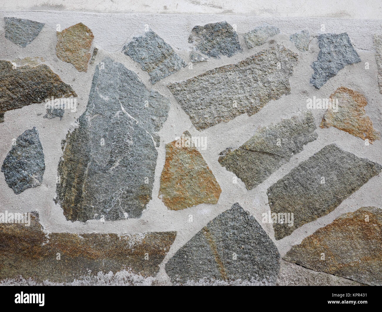 Wall with stones finish Stock Photo - Alamy