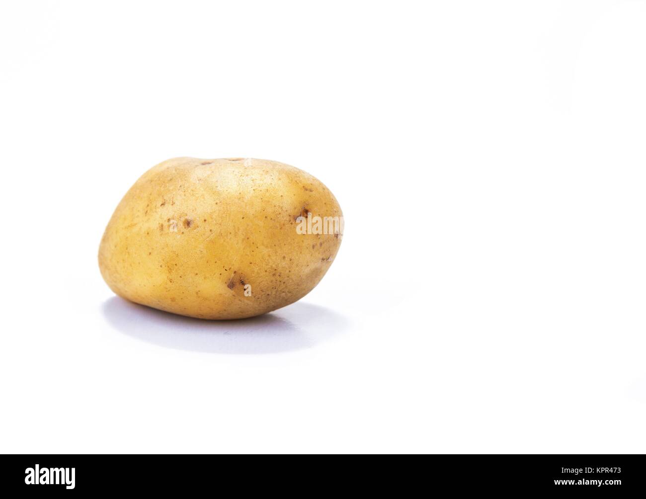 Big ripe potato on the white background Stock Photo - Alamy