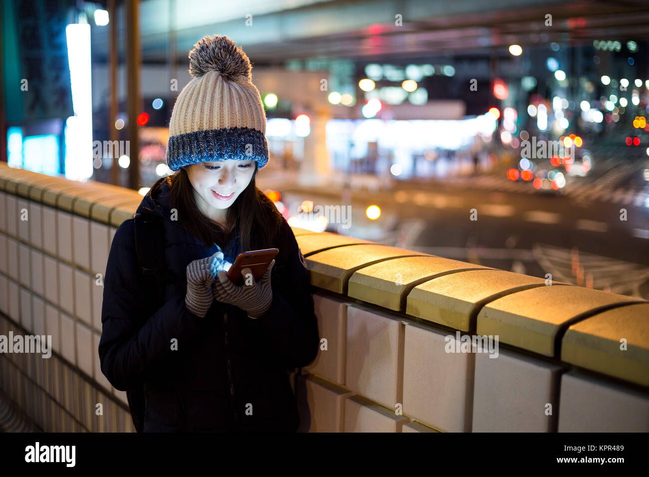 Woman use of cellphone at night Stock Photo - Alamy