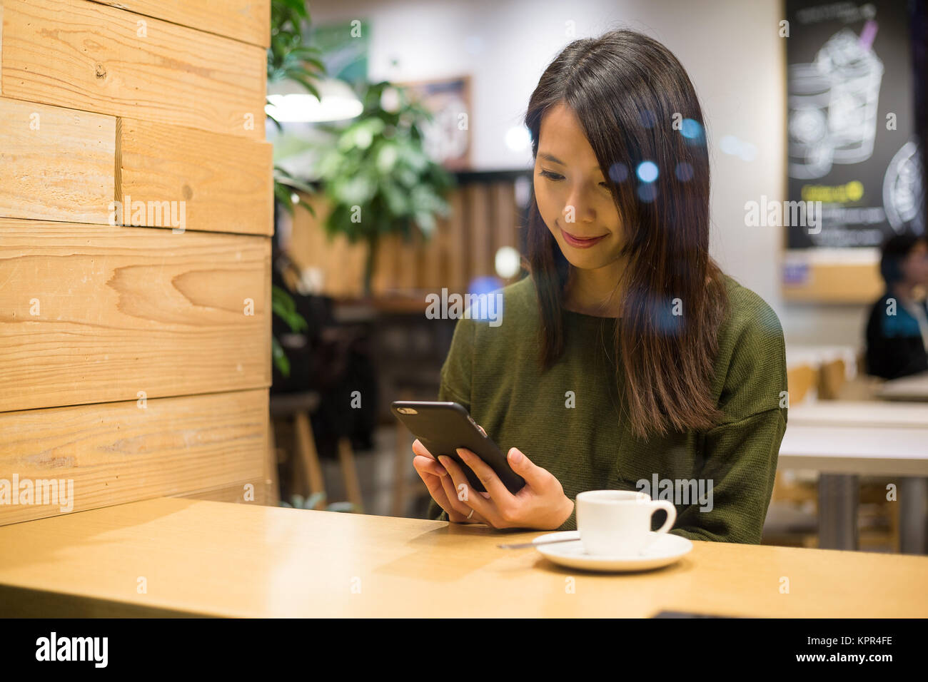 Woman enjoy her coffee in coffee shop Stock Photo - Alamy