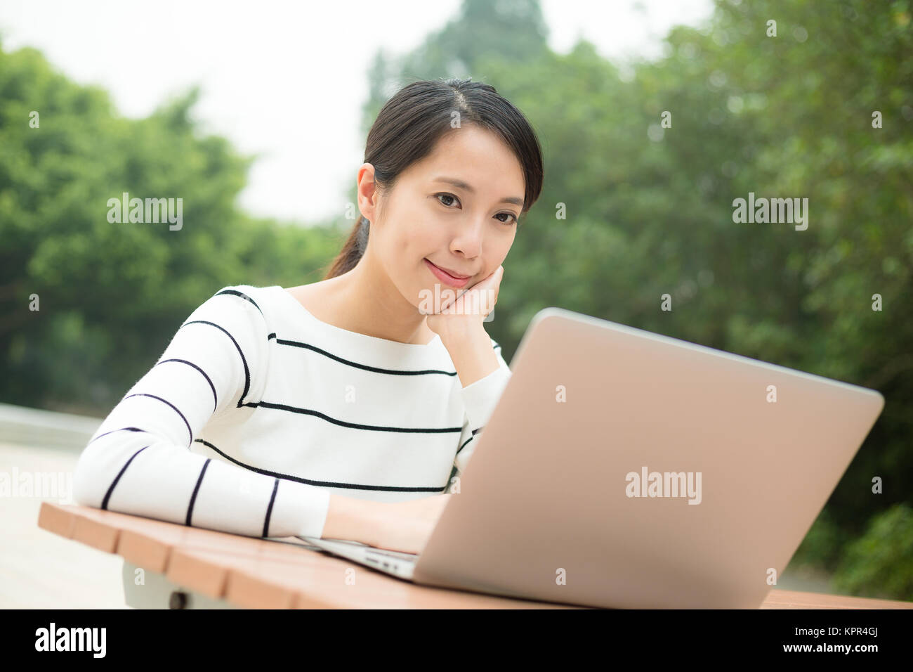 Asian Woman use of laptop computer Stock Photo - Alamy