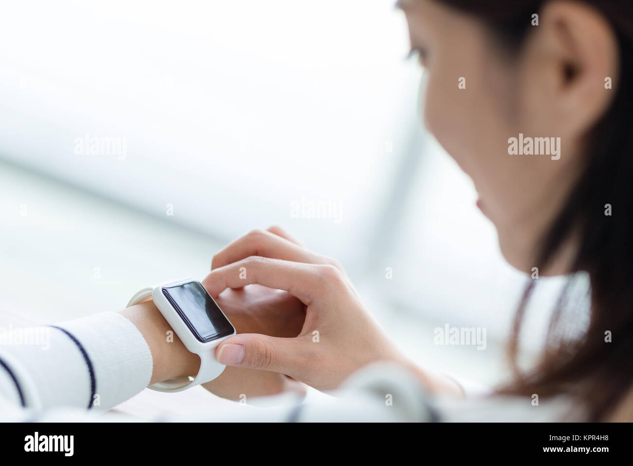 Young Woman use of the wearable watch Stock Photo - Alamy
