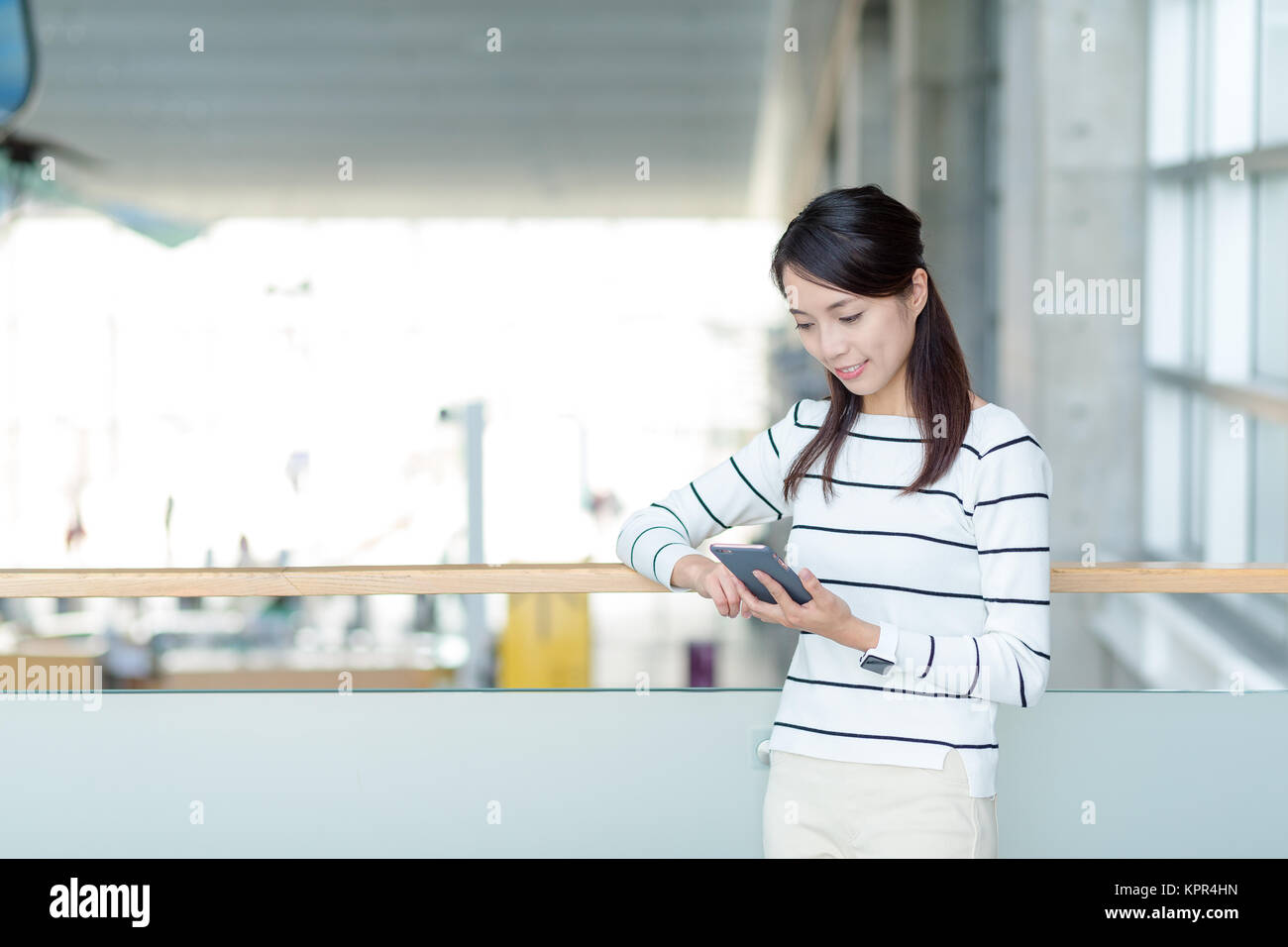 Asian woman using mobile phone Stock Photo - Alamy