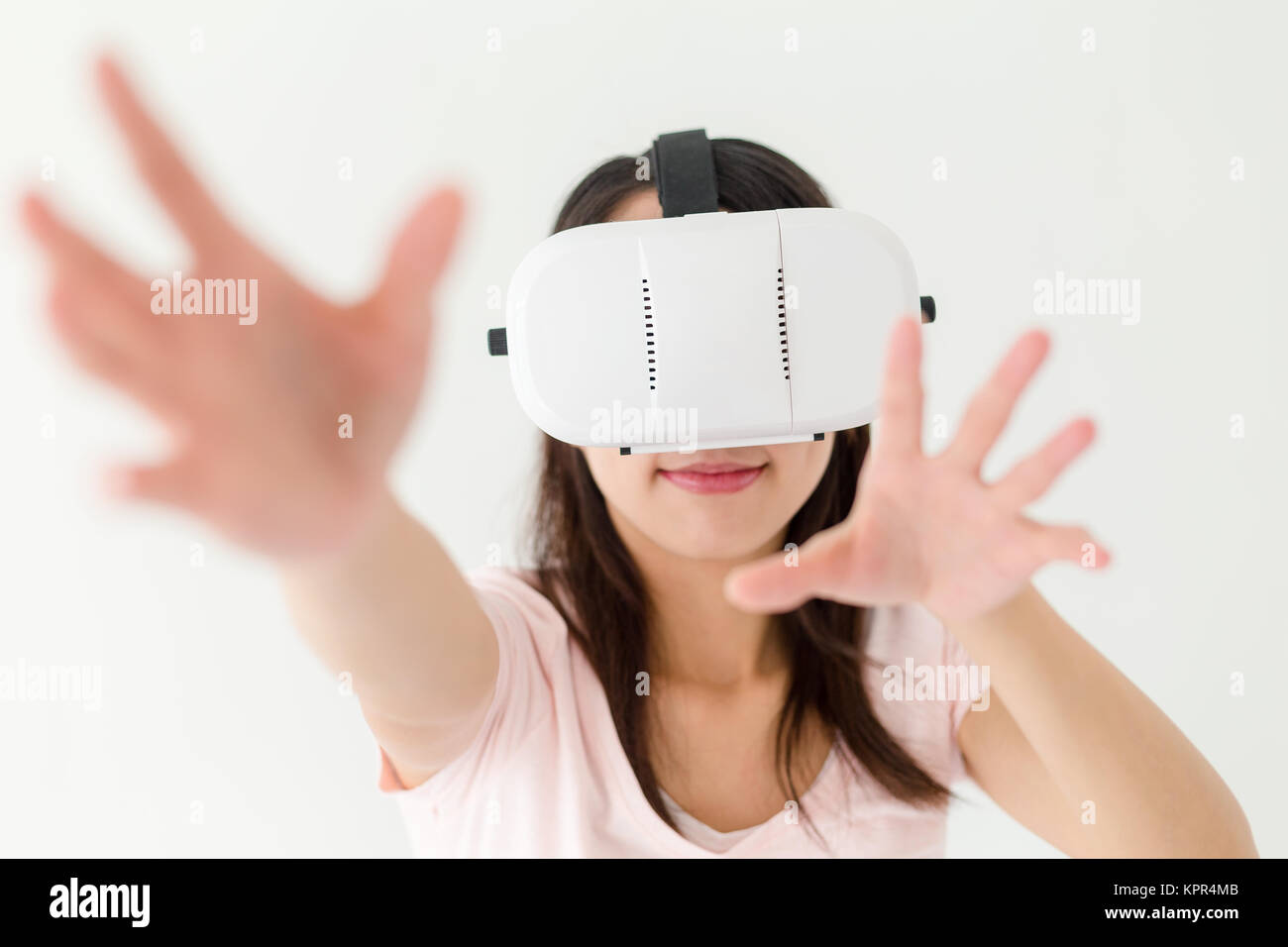 Woman feeling shock when using vr device Stock Photo - Alamy