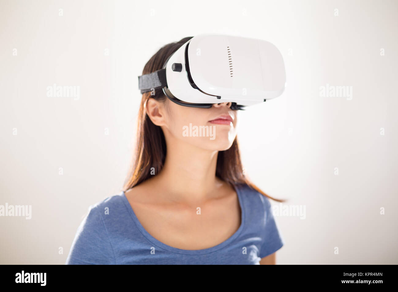 Woman use of VR device Stock Photo - Alamy