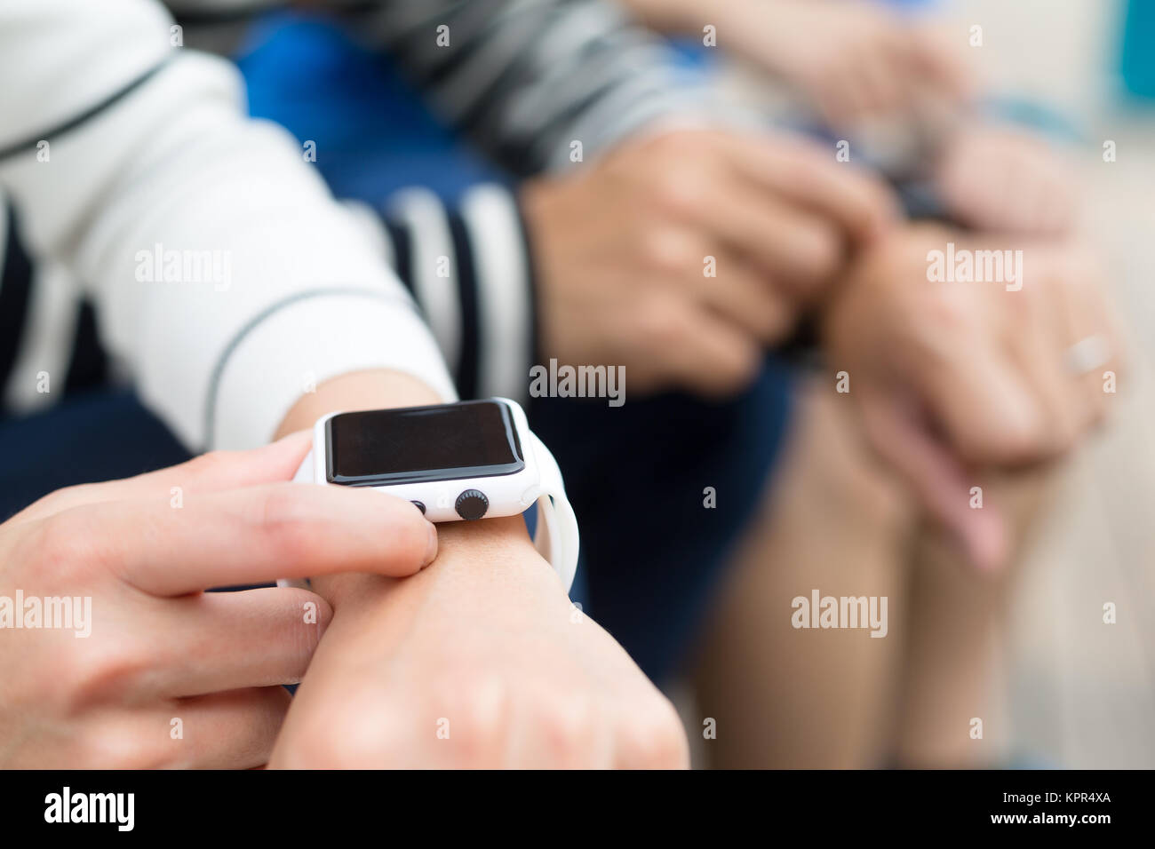 Group of people using smart watch together Stock Photo - Alamy